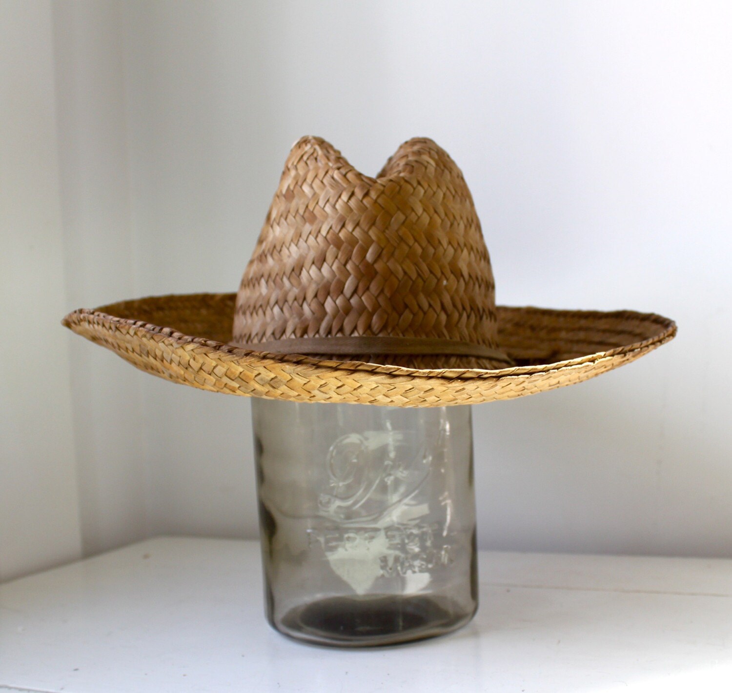 vintage 1950s straw hat. gardener and farmer hat with a wide