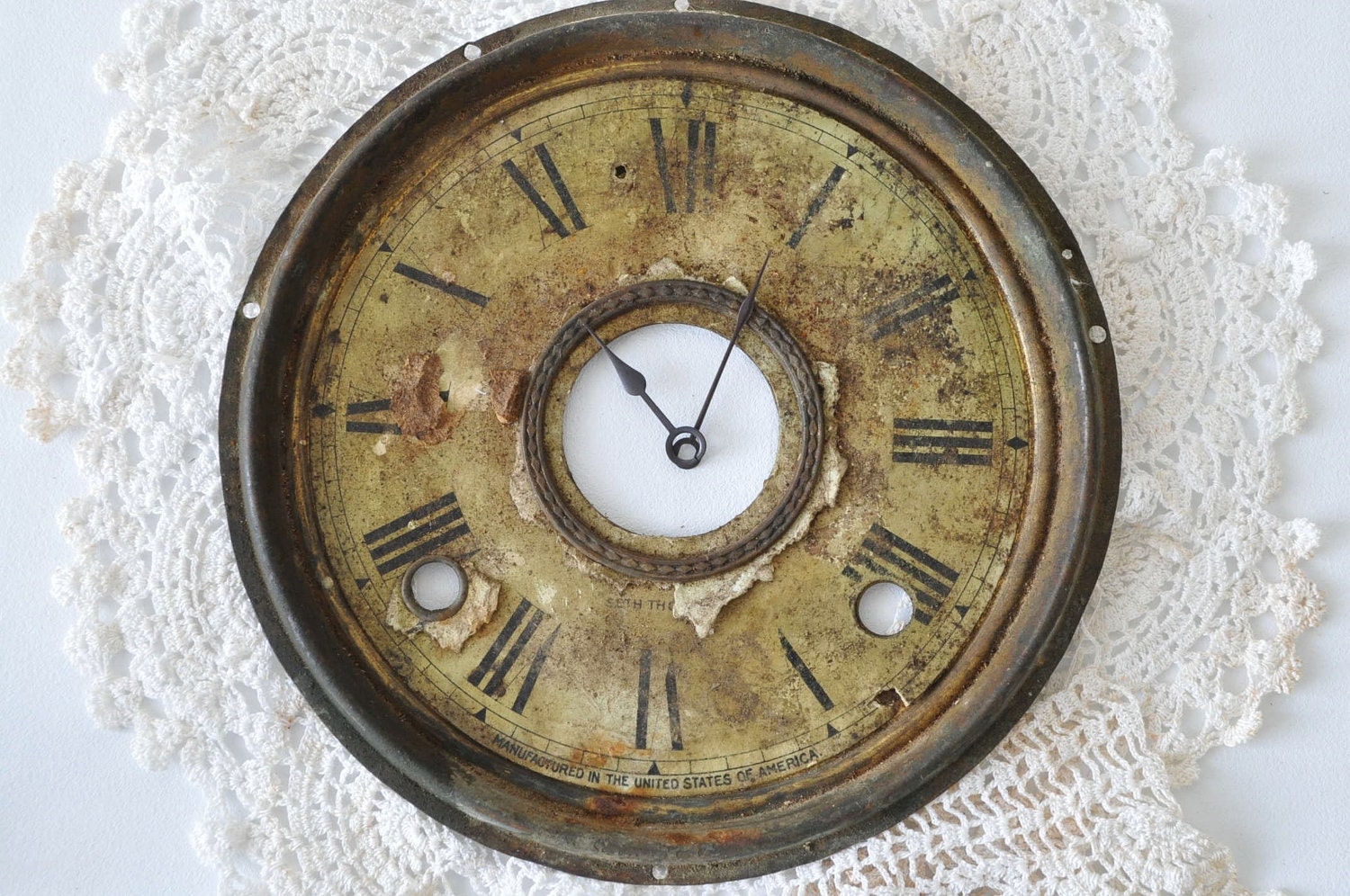 vintage rusty worn clock face with clock handsmixed media