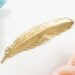 4 gold FEATHER jewelry embellishments 53mm x 14mm by ThePeddler