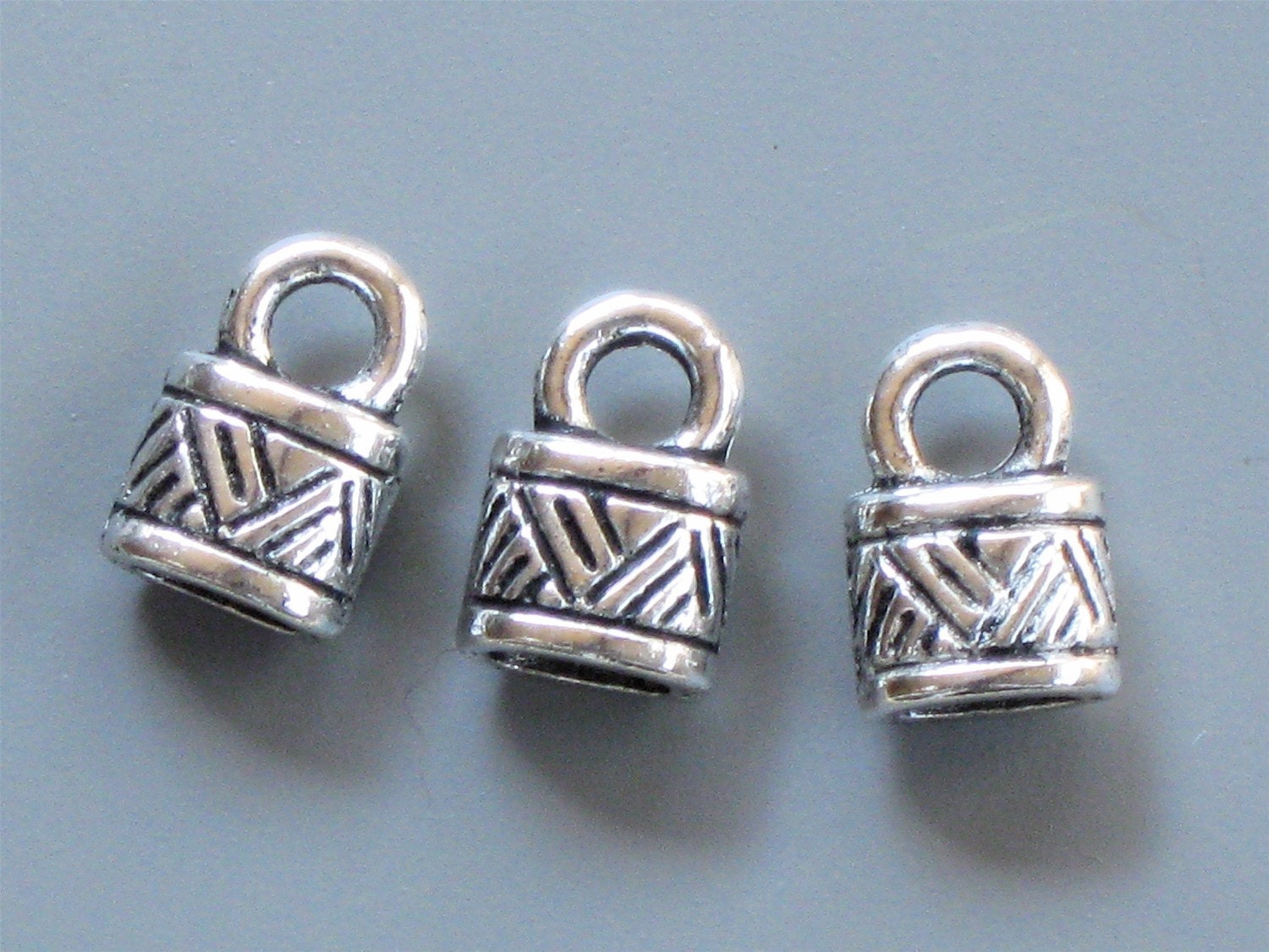 8 silver oval jewelry END CAPS with loop . Perfect for