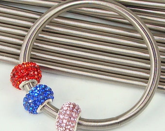 Silver coil bracelet | Etsy