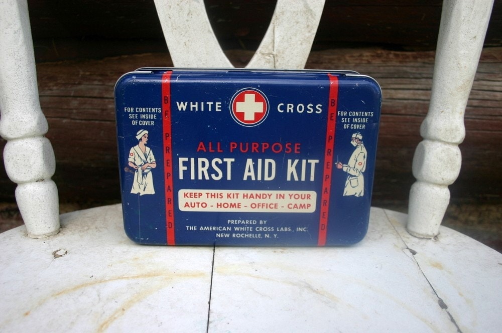 Vintage White Cross First Aid box with supplies