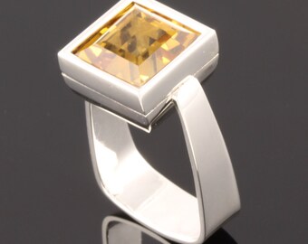 Sterling silver ring set with one 5mm square facet Rhodolite