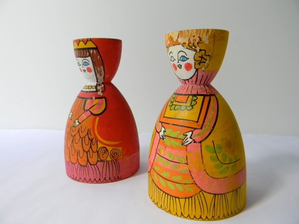 Two painted wood doll candle holders