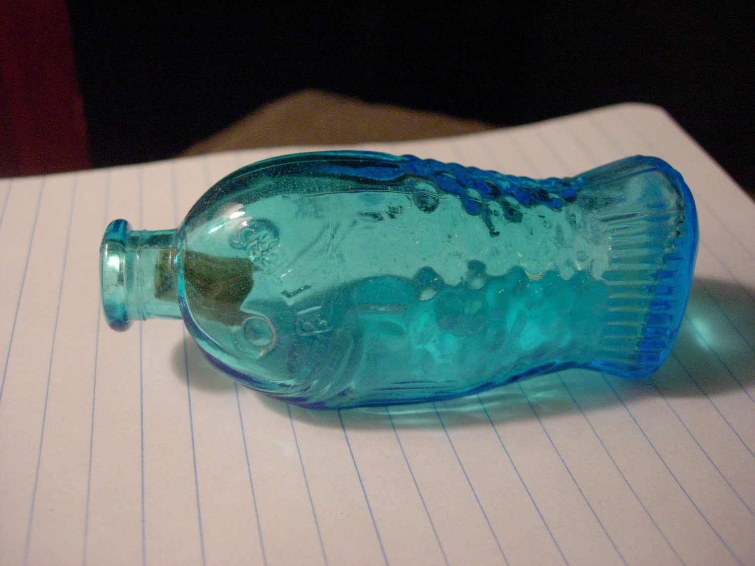 Small decorative fish-shaped bottle blue glass