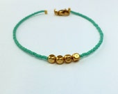 Items similar to Teal and Gold Beaded Stacking Bracelet on Etsy