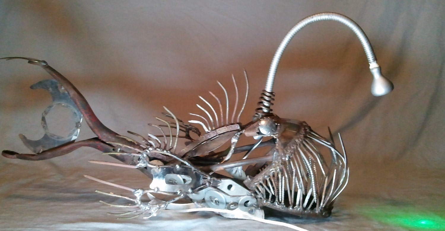 Scrap metal angler fish sculpture with working light