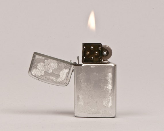 1950s Storm King Lighter With Embossed Jigsaw by LuminousWhatnots