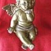 Gold Painted Ceramic Cherub Angel Blowing by FunkAndMoreVintage