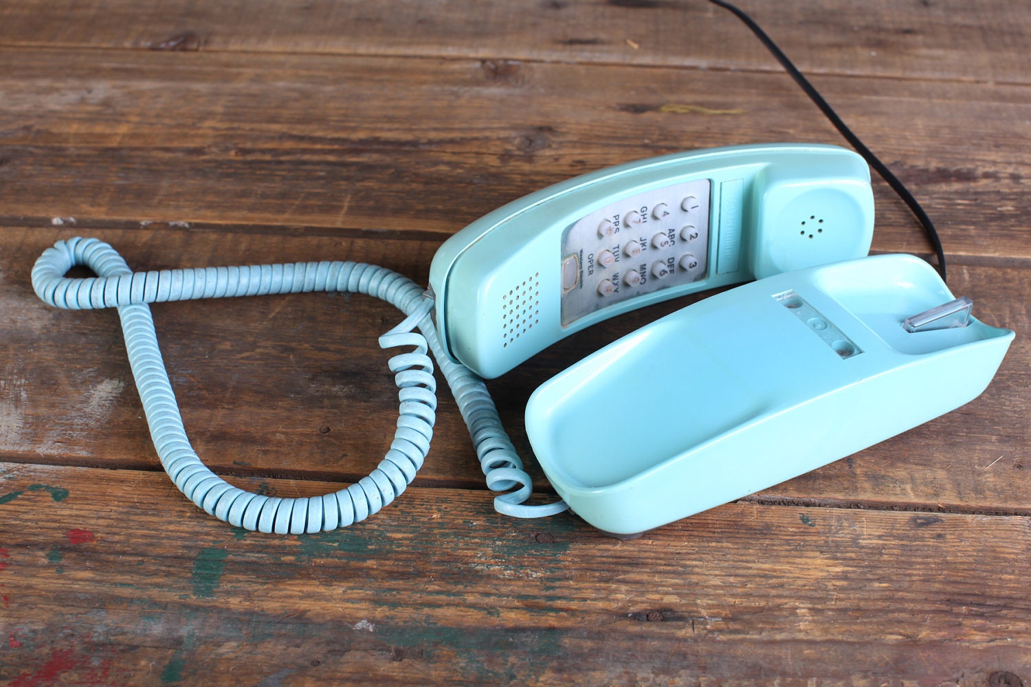 Retro turquoise telephone working phone push button phone