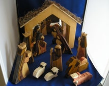 Wood intarsia nativity set with manger.
