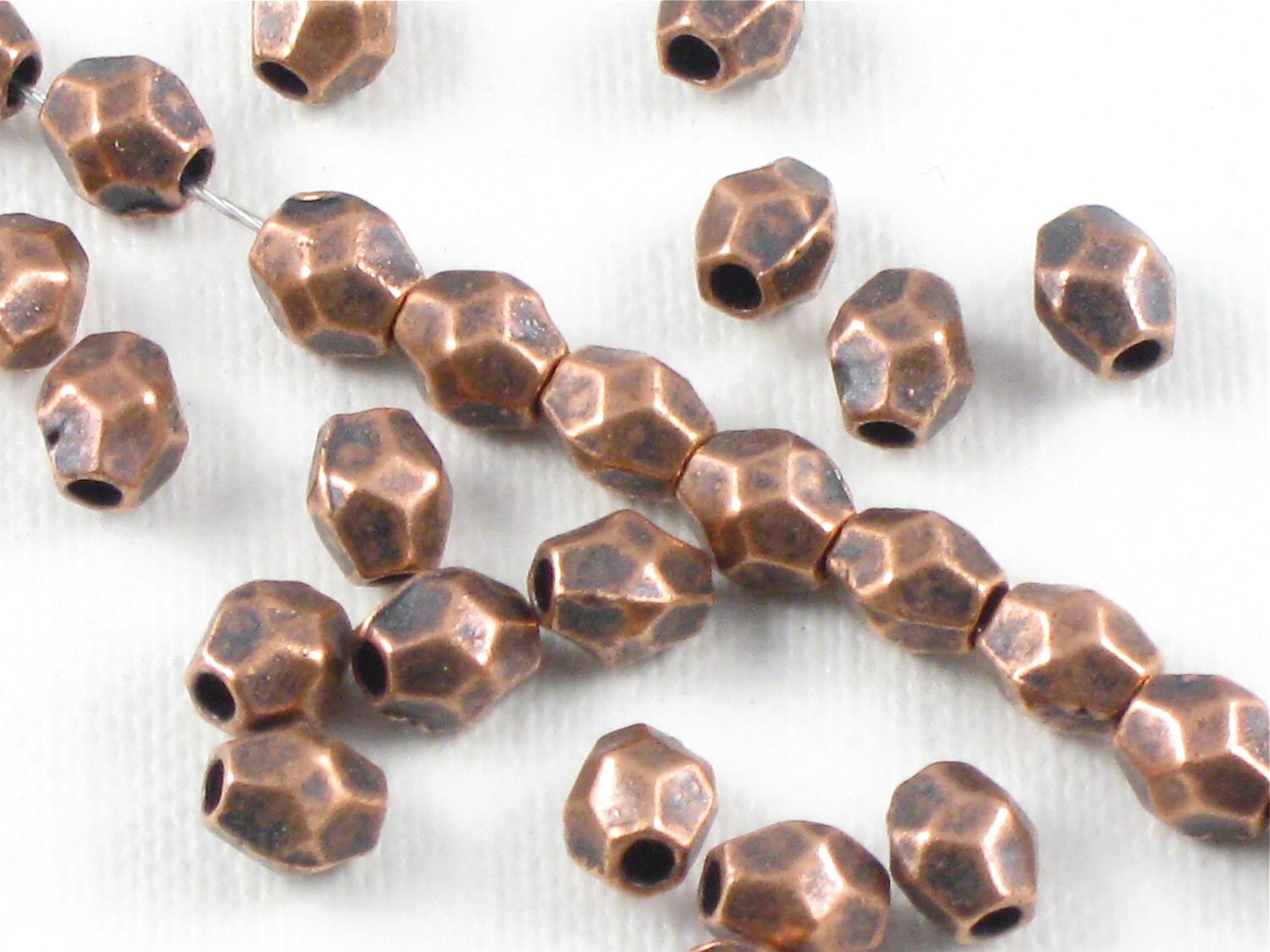100 faceted metal spacer BEADS in Antique Copper. by ThePeddler