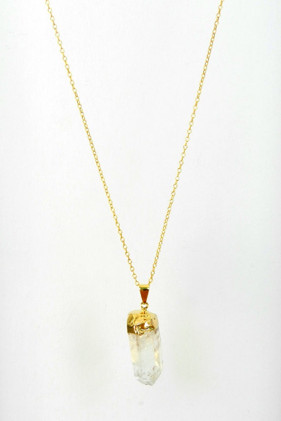 Gold dipped quartz point necklace by BipAndBop on Etsy