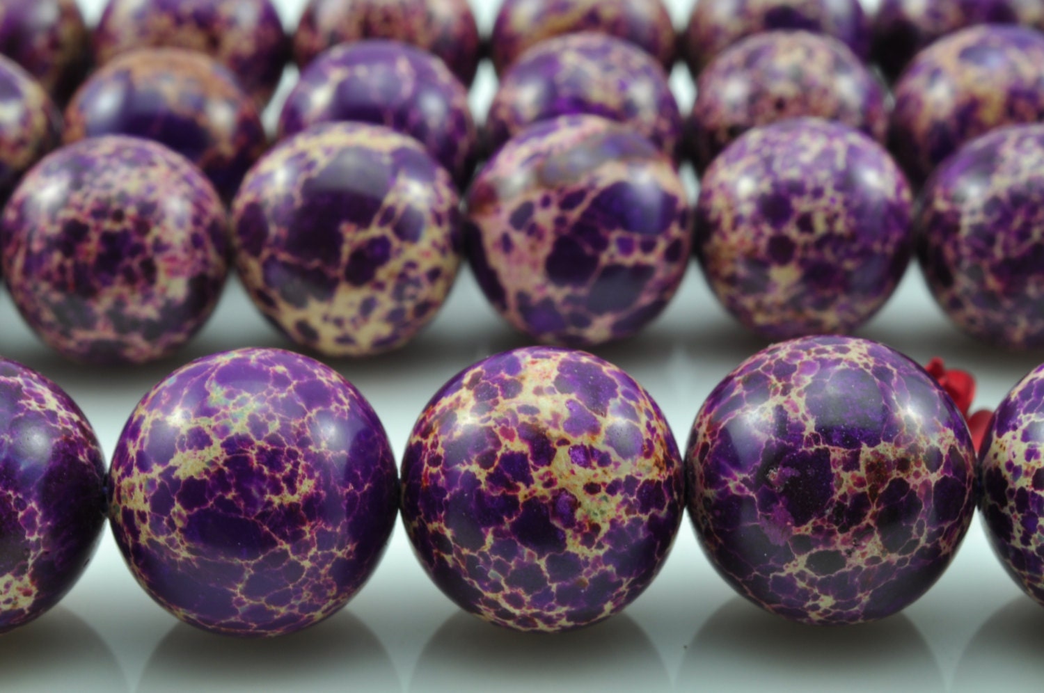 62 pcs of Purple Emperor stone smooth round beads in by YesBeads