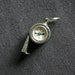 Antique whistle with a built-in compass. Never lose your way