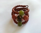 Items similar to Brown beaded memory wire ring on Etsy