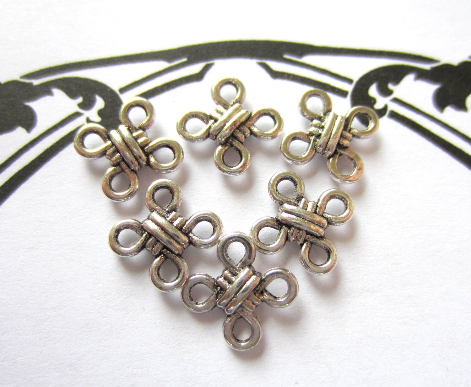 16 Antique silver connectors knotted jewelry charms pendants