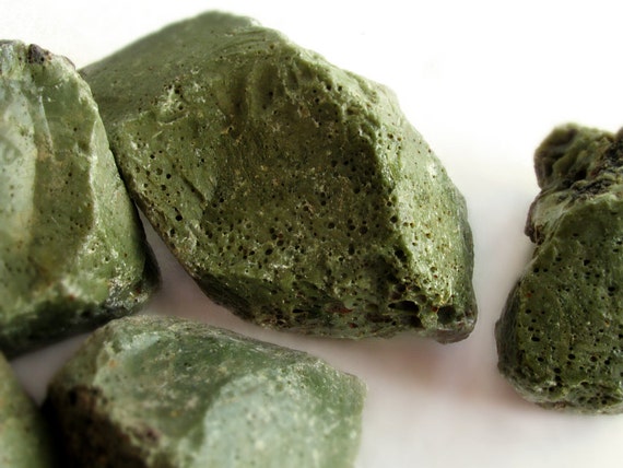 Olive Green Slag. Slag glass metallurgy byproduct.