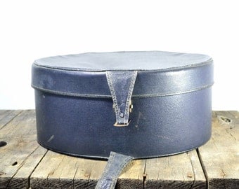 Vintage hat box with paisley fabric.