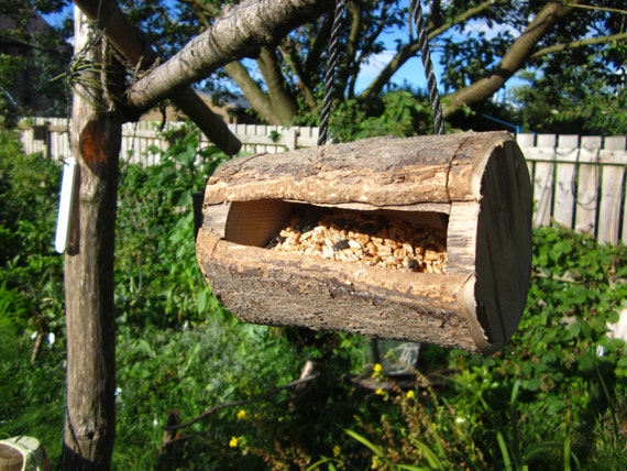 Rustic log bird feeder every one individual
