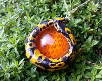 Royal / ball python pendant with amber coloured inset, real snake skin