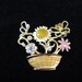 Pretty gold tone KC vintage basket pin brooch with flowers and