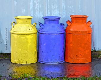 Reflective, colorful, old-fashioned milk cans, artistically displayed!