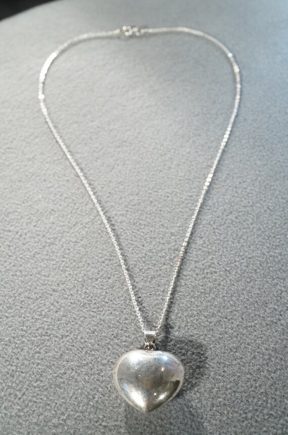 vintage sterling silver puffed heart shaped pendant with a