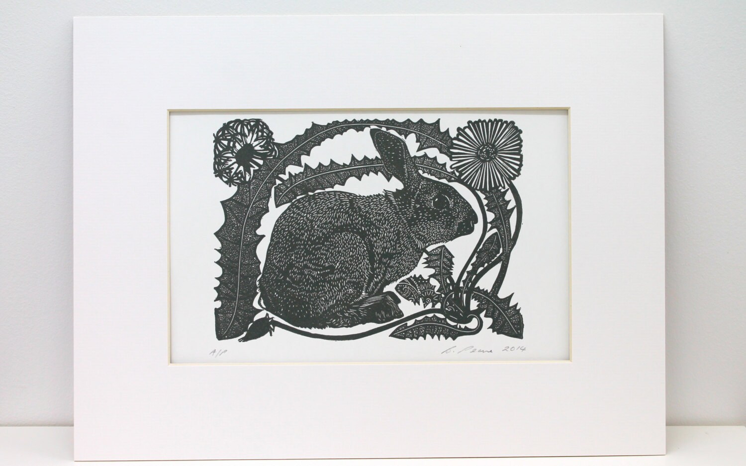 Linocut of a rabbit with a dandelion by BabsPeaseDesign on Etsy