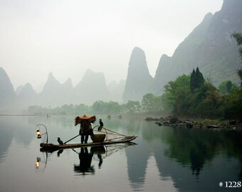 Fisherman with cormorant birds on Li River by KingWuPhotography
