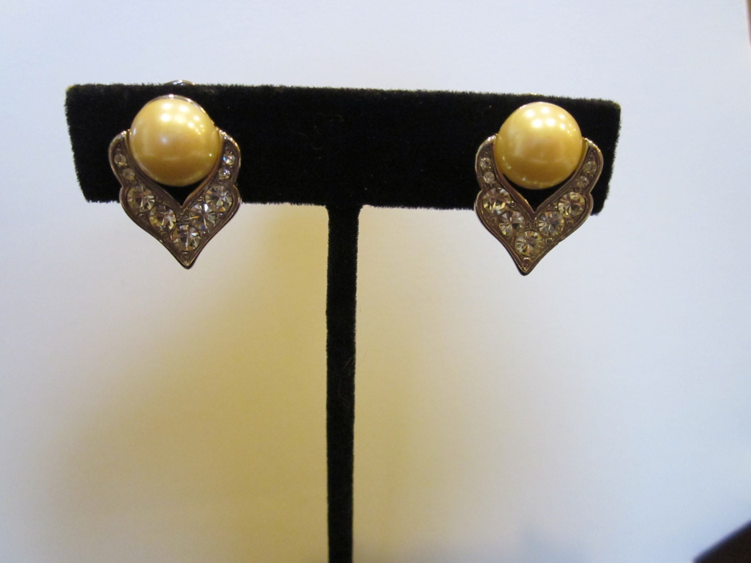 Signed Monet Silver Toned Clip Back Earrings Containing a Central Faux ...