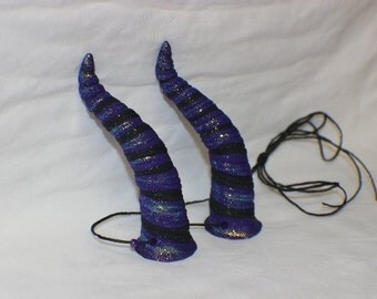 Purple and black twisted dragon horns with purple glitter