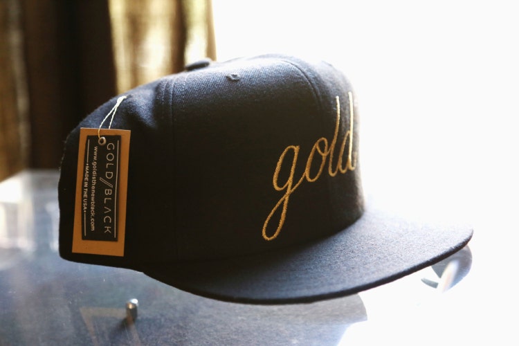 Snap back black baseball cap with gold by FoundByAPropStylist