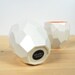 Modern ceramic cup handmade in polygons facetted design