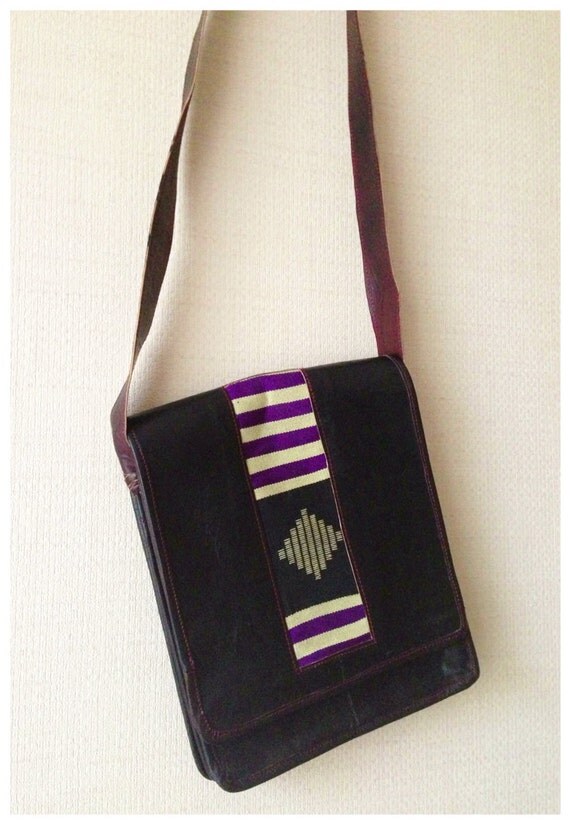 Items similar to Hand made leather messenger bag with kente weave on Etsy