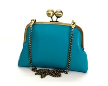 Popular items for turquoise clutch on Etsy