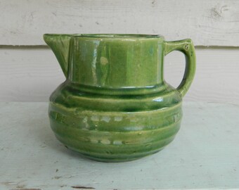 Items similar to 1960's McCoy Pitcher on Etsy