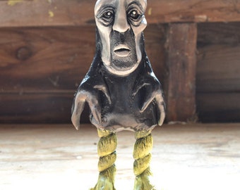 Resin birdman sculpture