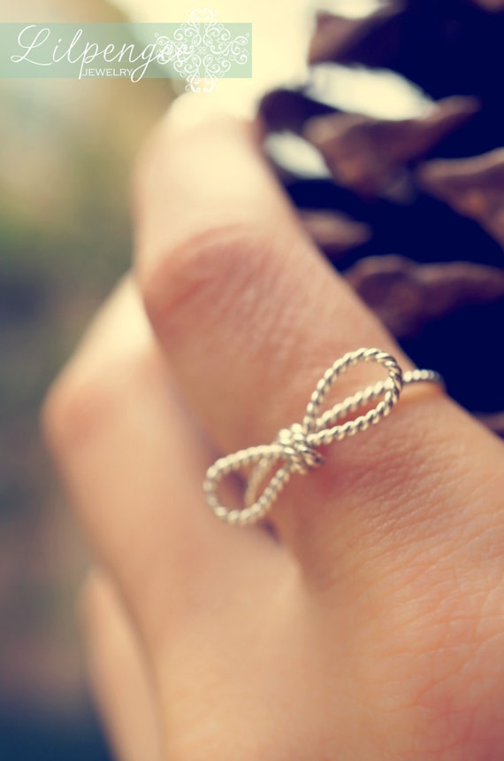 Items similar to tied no.6 - skinny twisted rope bow rings. silver bow ...
