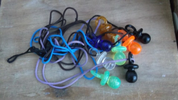 Plastic toy pacifiers from the 90's.