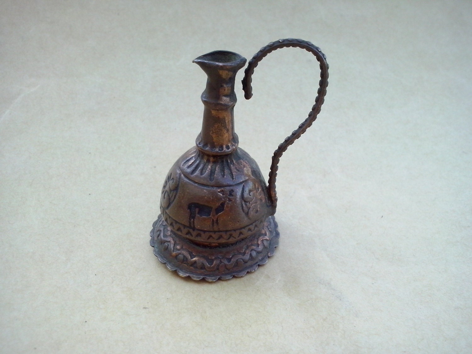 Vintage copper miniature pitcher, etched with animal patterns, textured ...