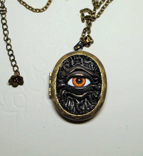 Antique Locket with leather evil eye design. by LeasBoutique