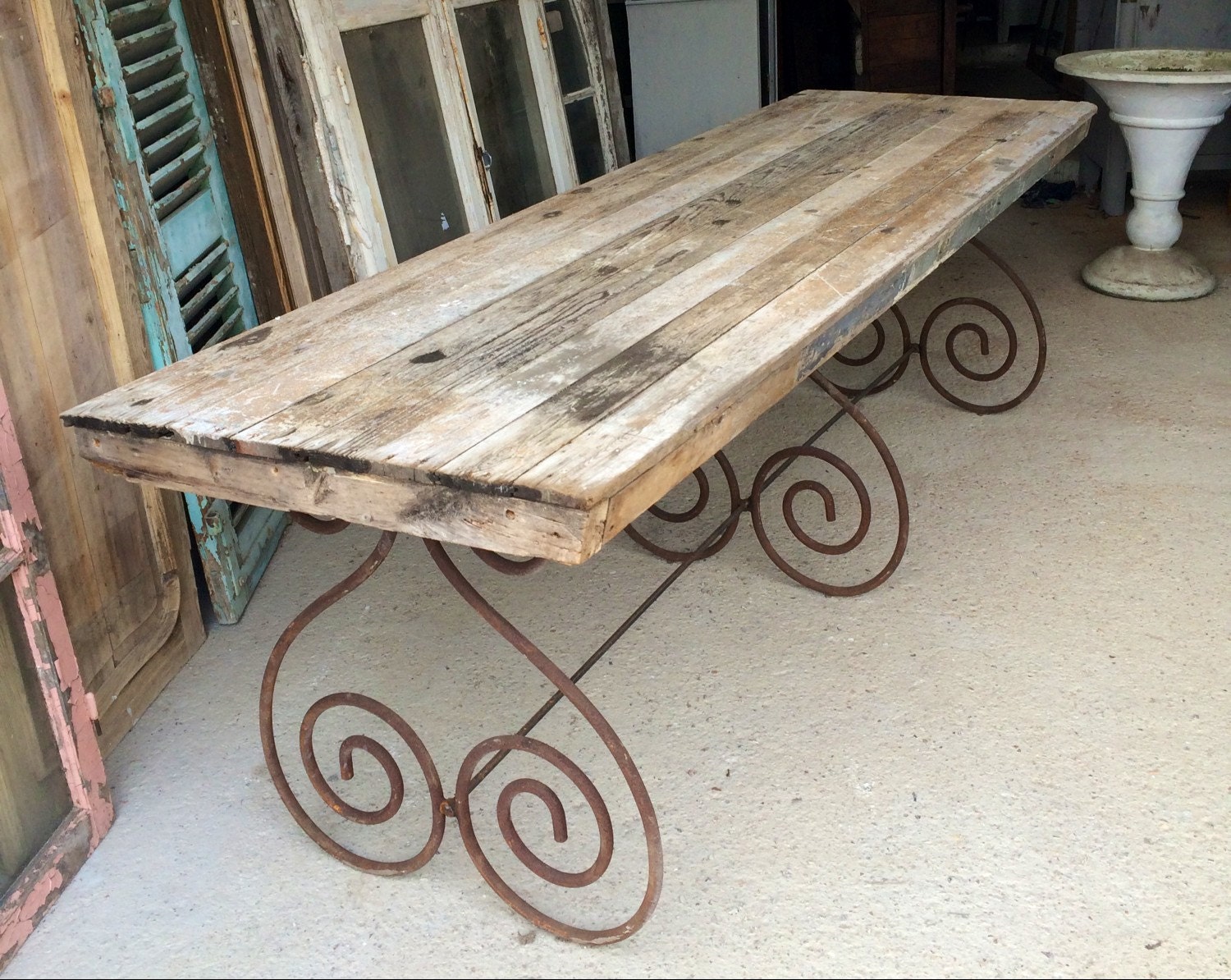 Lovely wooden dining table on rusty but pretty base – Haute Juice