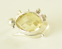 9 carat yellow topaz of gem quality set in sterling silver on a ...