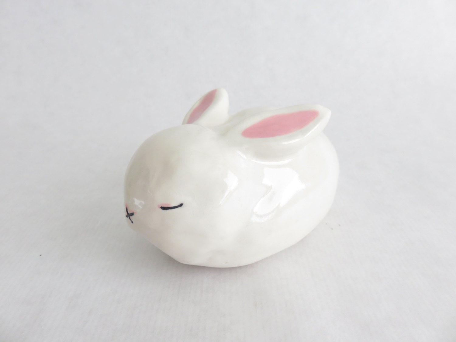 Rabbit Ceramics and Pottery white bunny sculpture Slepping