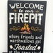 Fire Pit Sign Where Friends and Marshmallows Get Toasted At