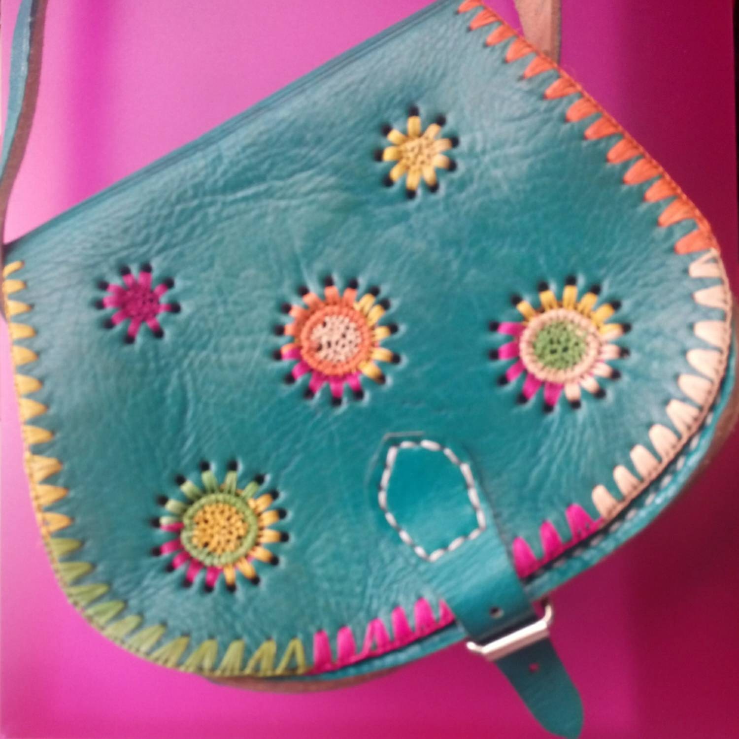 Turquoise leather handbag, made in Morocco, with yellow and pink ...