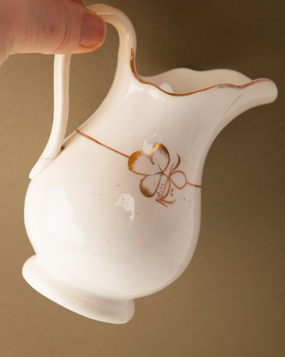 Small white pitcher, small white jug, with shamrock or clover motif in ...