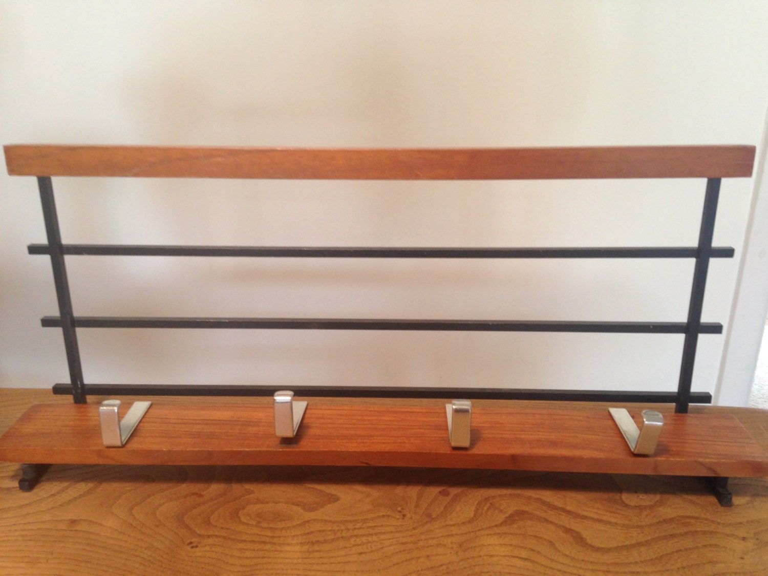 Perfectly practical striking 1960s teak wood and metal wall mounted ...