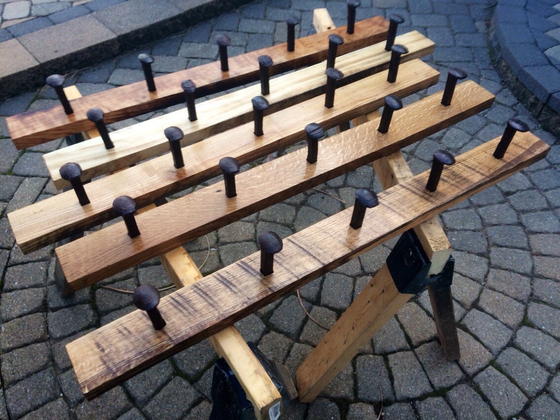 Rail road spike coat rack by RustBeltwoodwork on Etsy